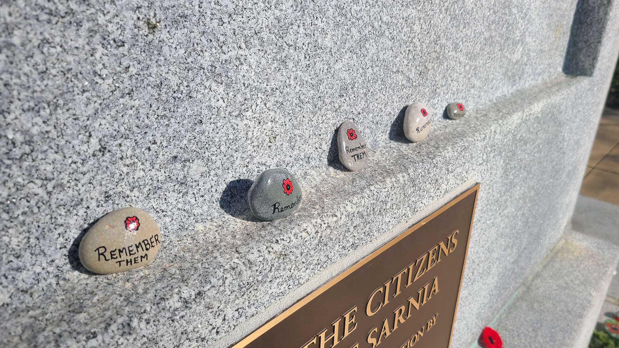 Remembrance rocks quietly displayed at Sarnia Cenotaph