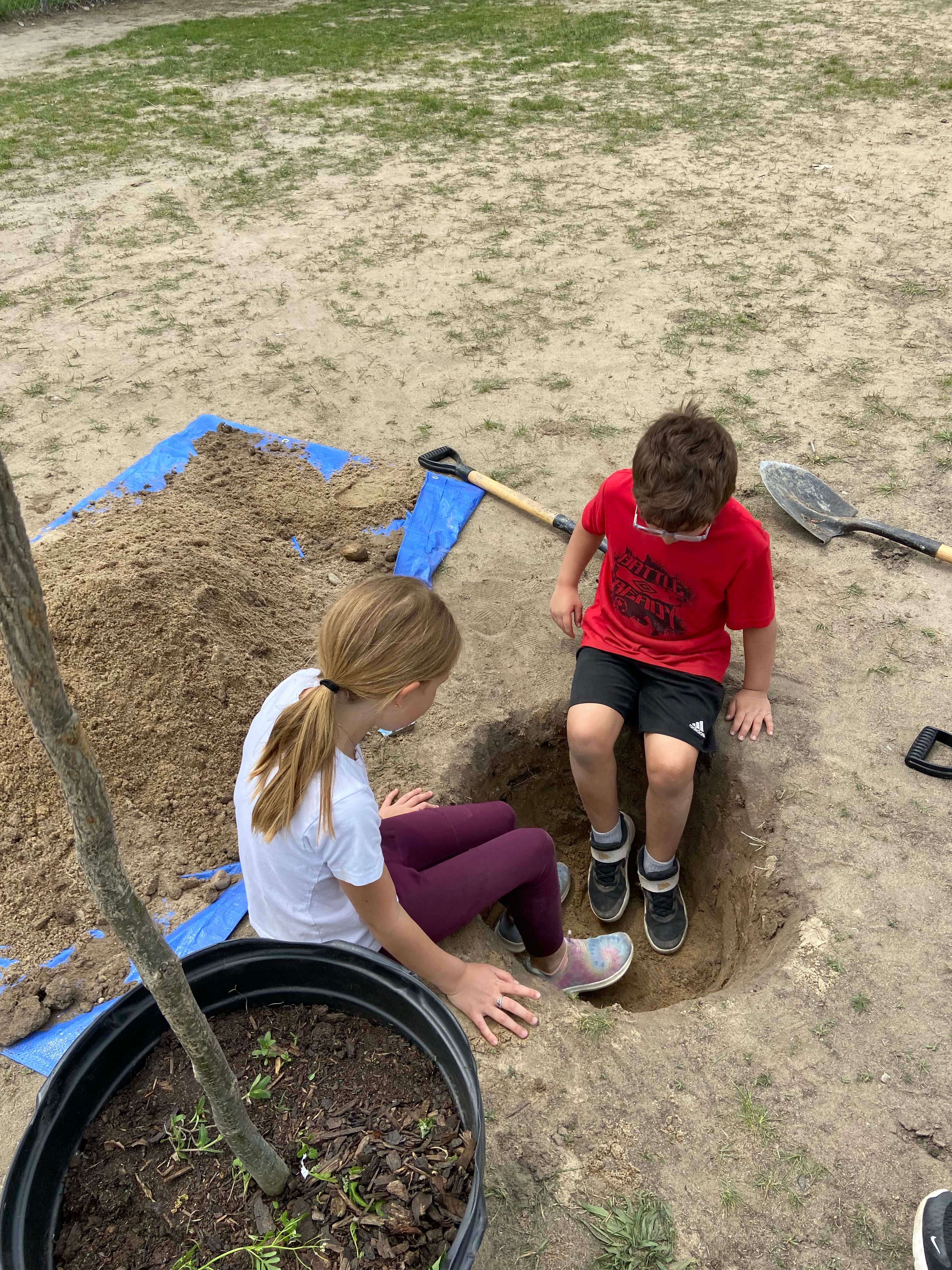 Students help plant shade trees at elementary schools [Gallery]