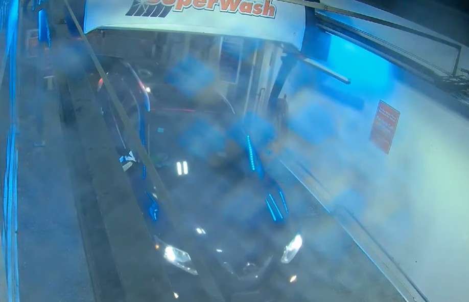 Driver sought in car wash crash