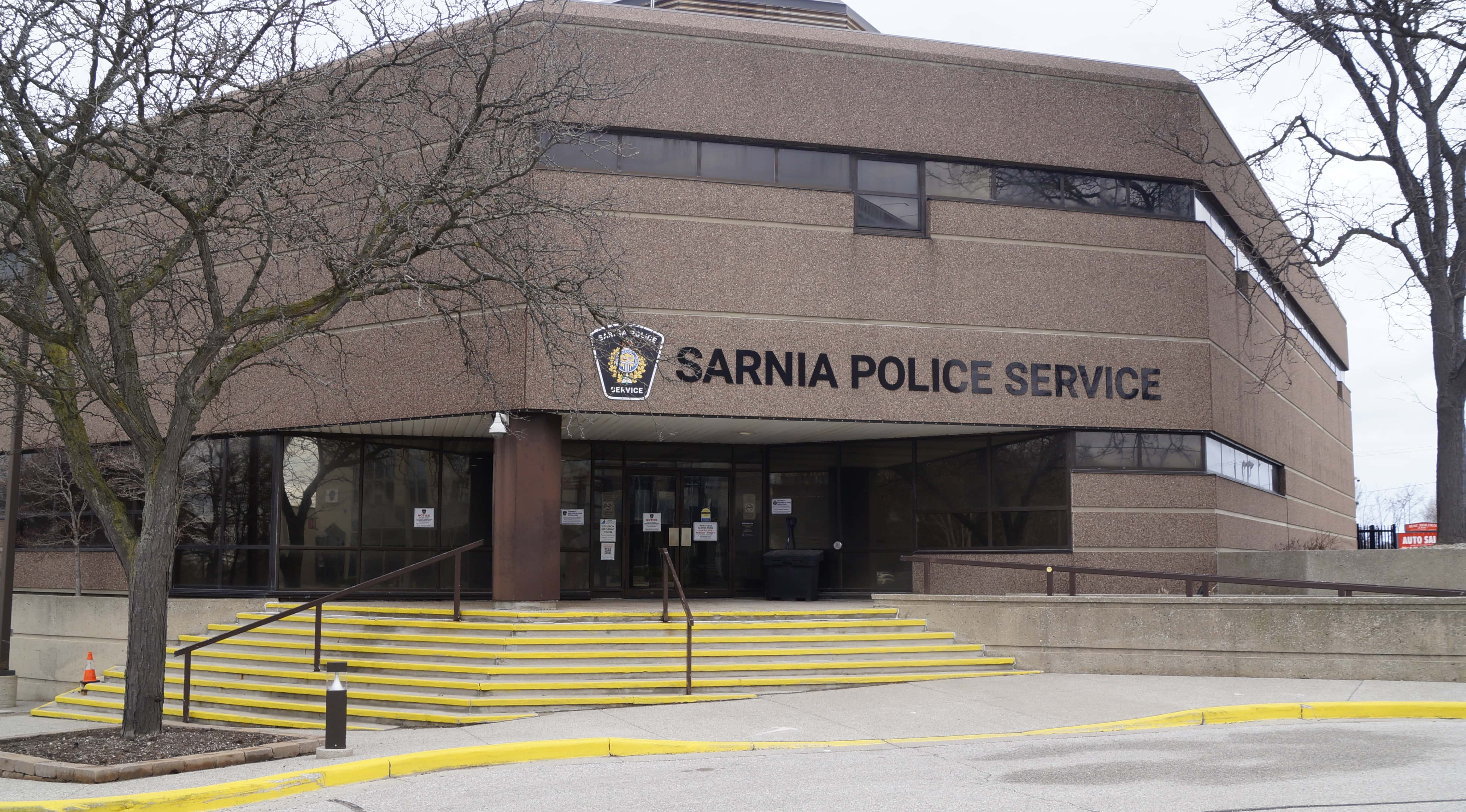 Sarnia police arrest two, seek a third on assault and threat charges